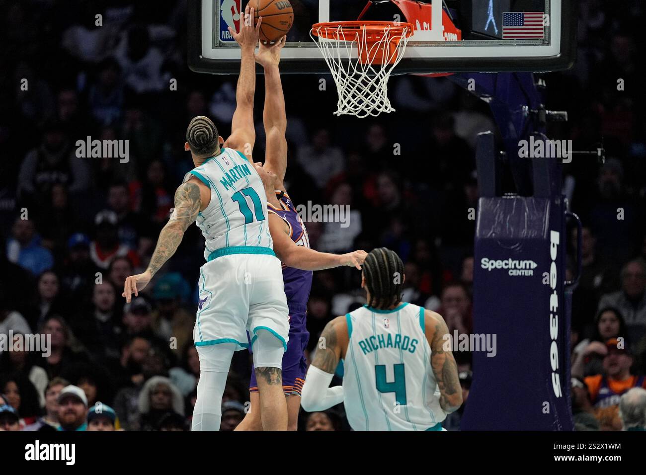 Charlotte Hornets forward Cody Martin (11) blocks a shot by Phoenix ...