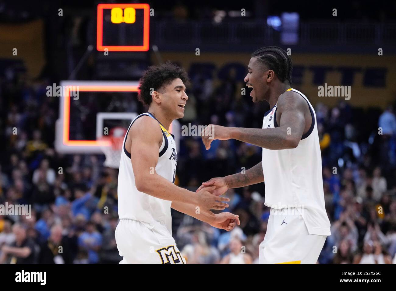 Marquette's Kam Jones and Stevie Mitchell celebrate after an NCAA ...