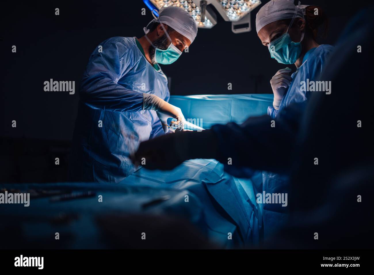 The surgical team operates with focused precision, utilizing advanced ...