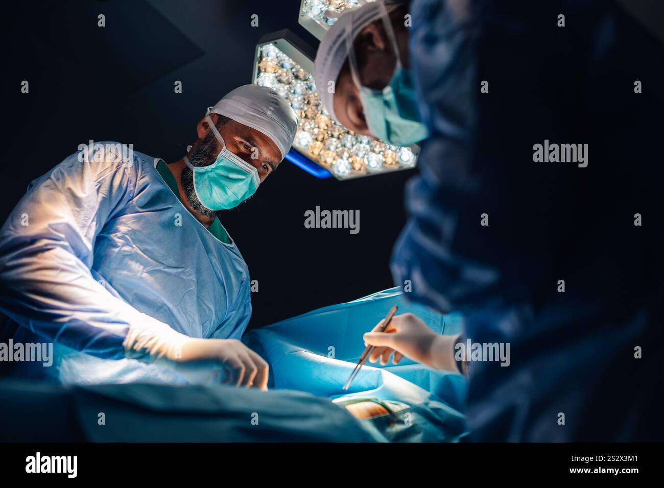 Captured in this image, doctors are diligently executing a surgical ...