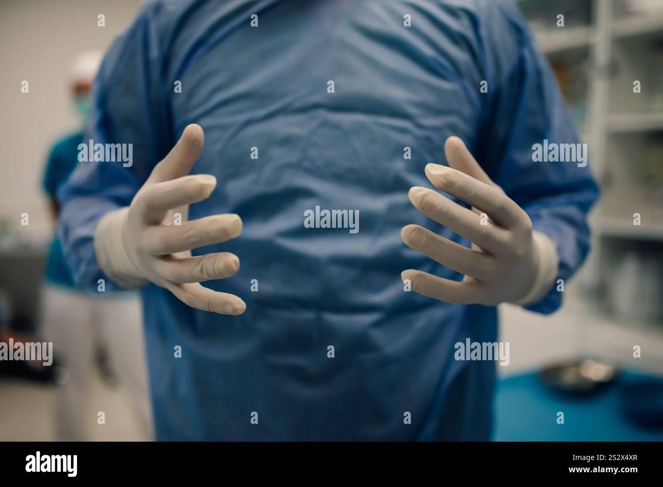 A medical professional is shown fully equipped and prepared for a ...