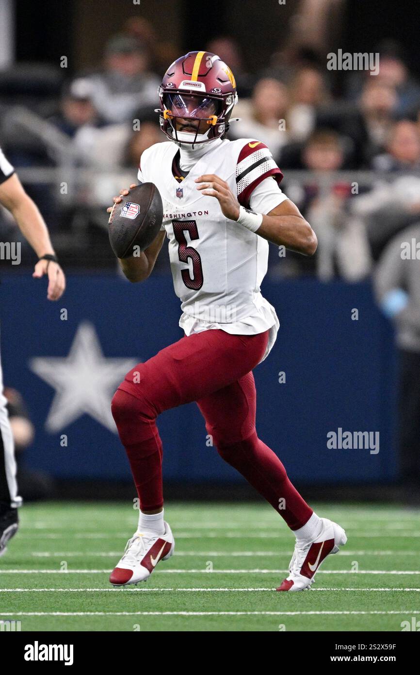 Washington Commanders quarterback Jayden Daniels (5) runs with the ball ...
