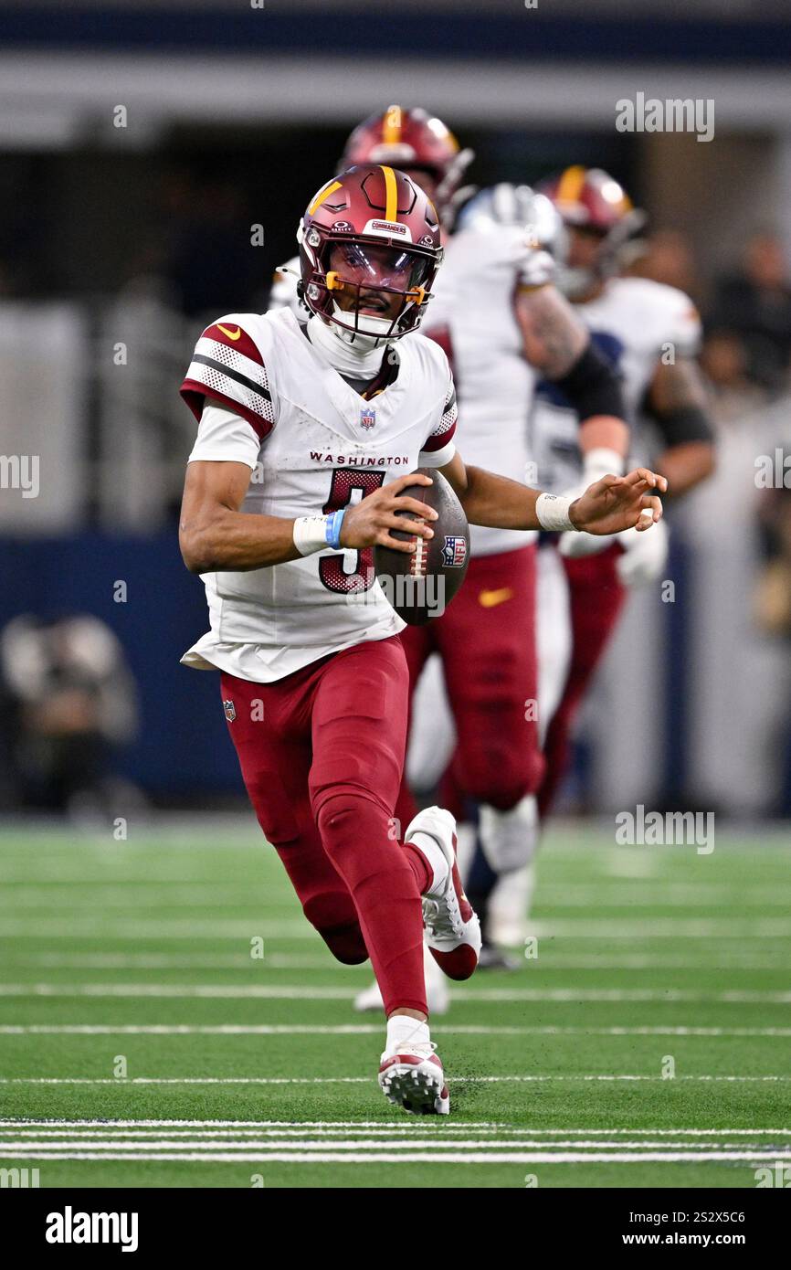 Washington Commanders quarterback Jayden Daniels (5) runs with the ball ...