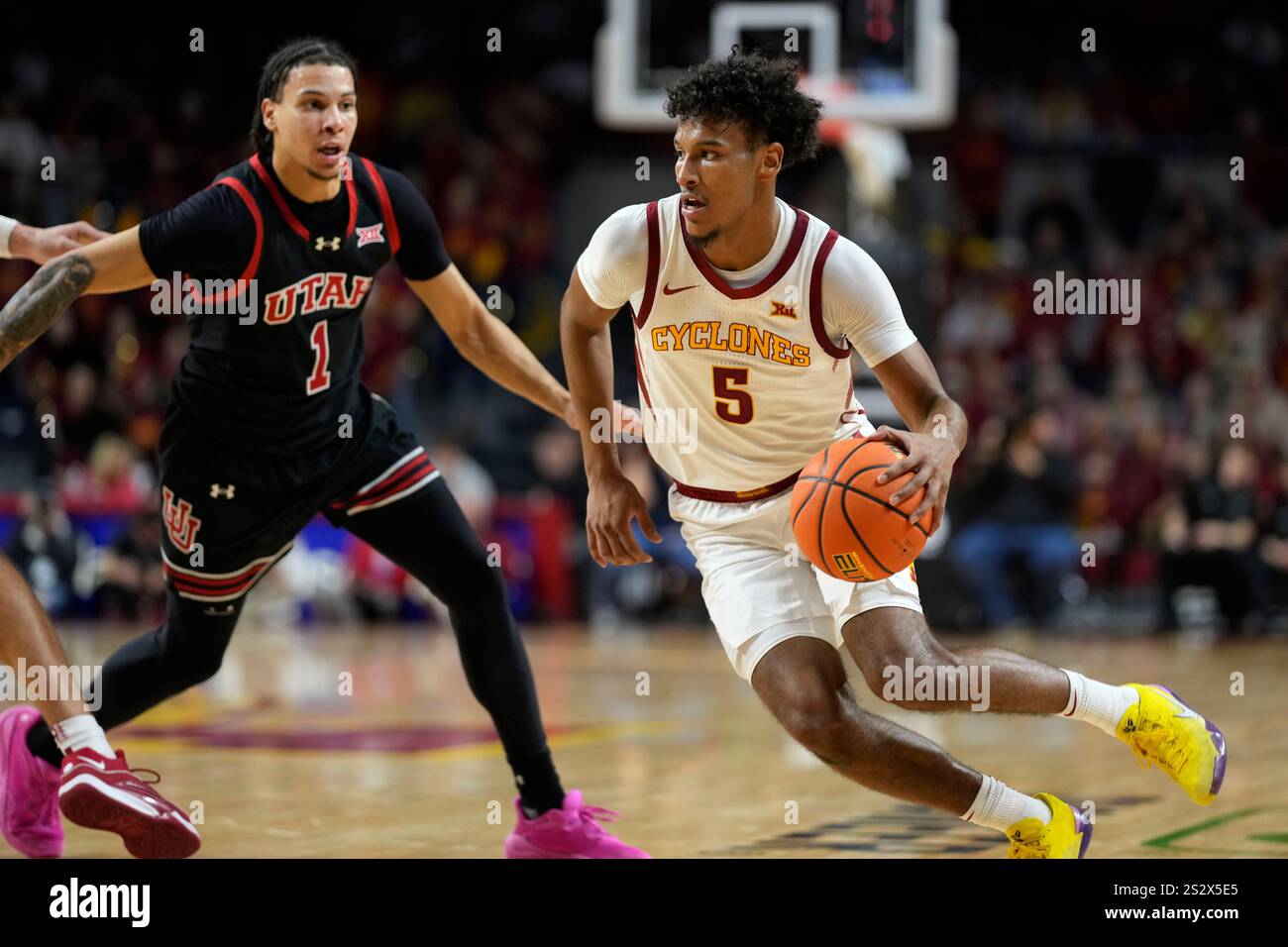 Iowa State guard Curtis Jones (5) drives past Utah guard Miro Little (1 ...