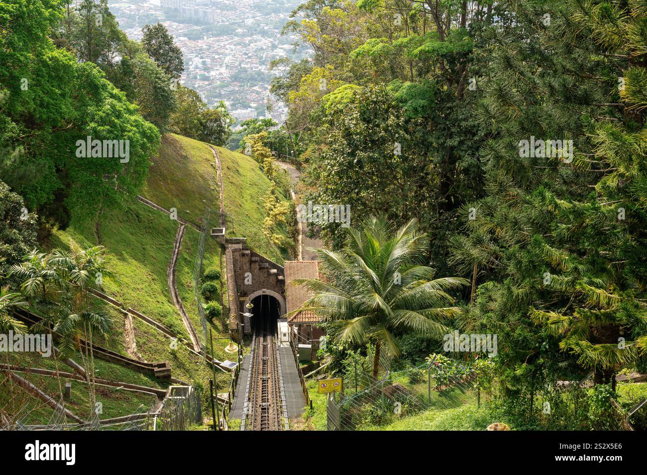 Penang Hill funicular railway in Malaysia, moving down hillside ...