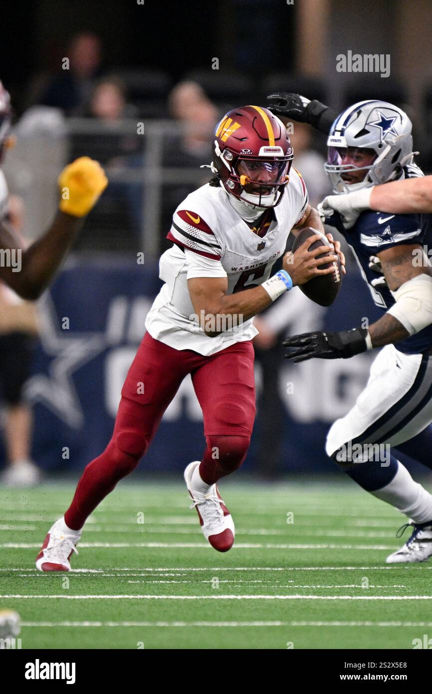 Washington Commanders quarterback Jayden Daniels (5) runs with the ball ...