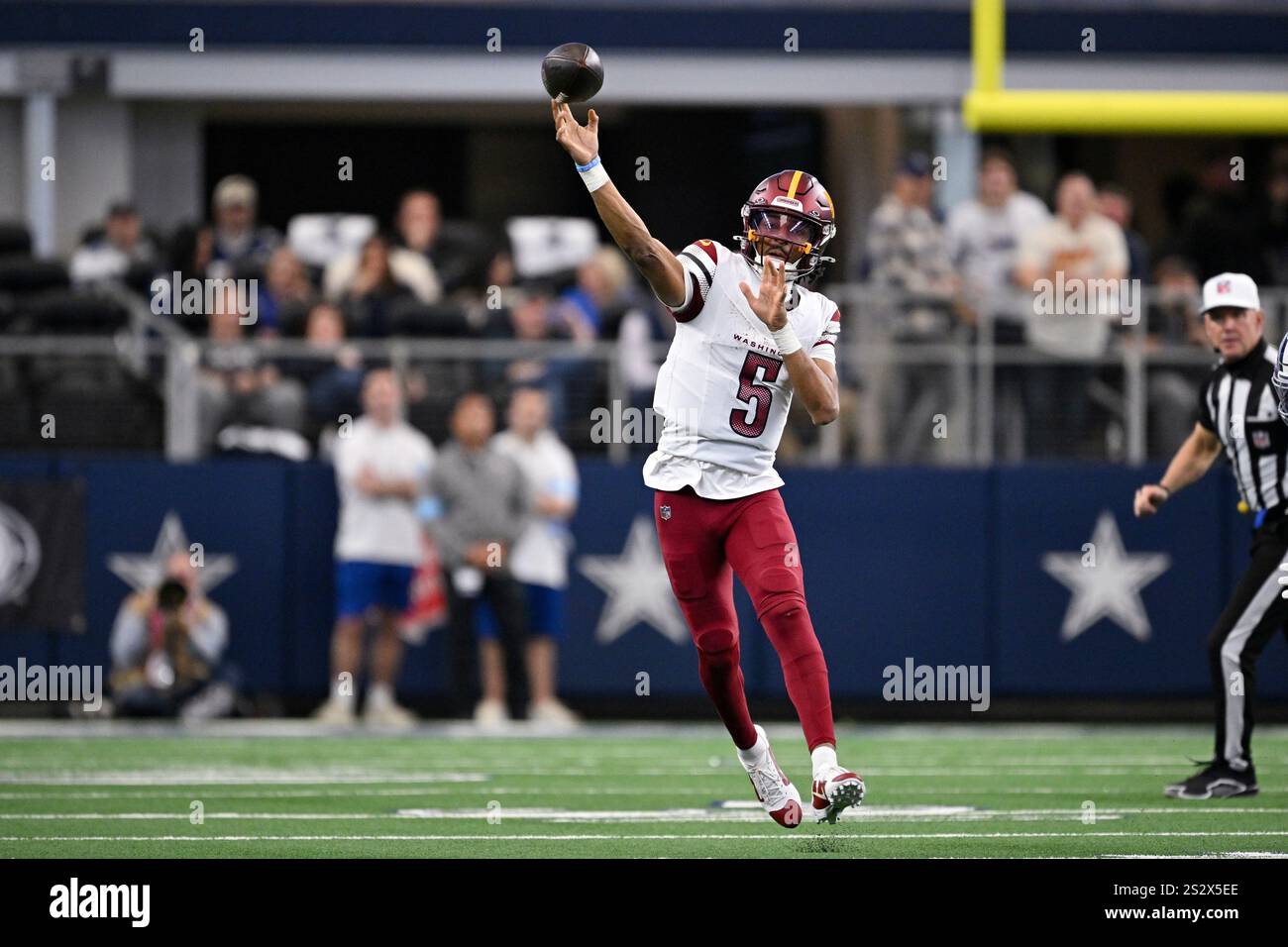 Washington Commanders quarterback Jayden Daniels (5) throws the ball ...