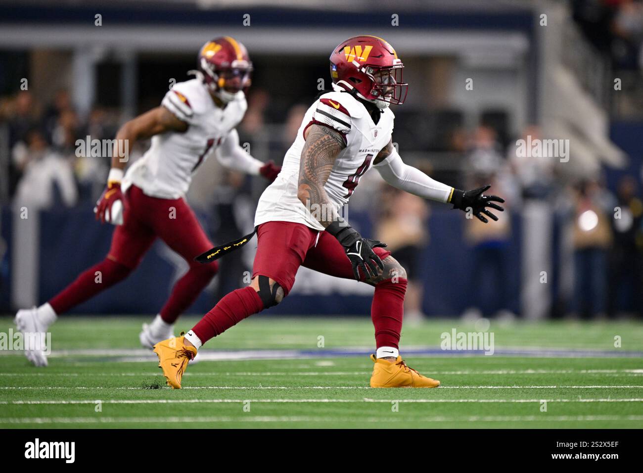 Washington Commanders linebacker Frankie Luvu (4) rushes the line ...