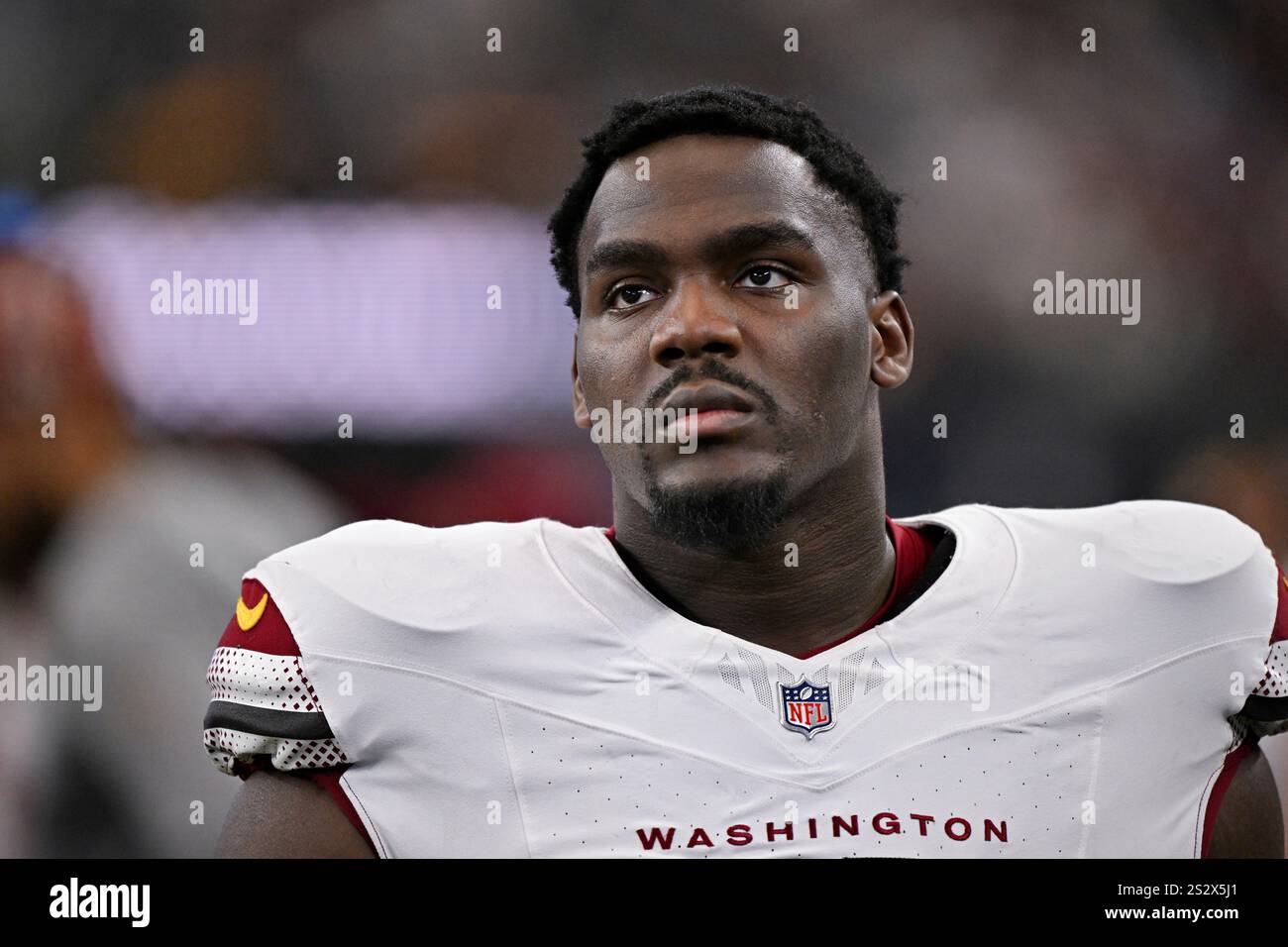 Washington Commanders guard Chris Paul (75) looks on from the sidelines ...