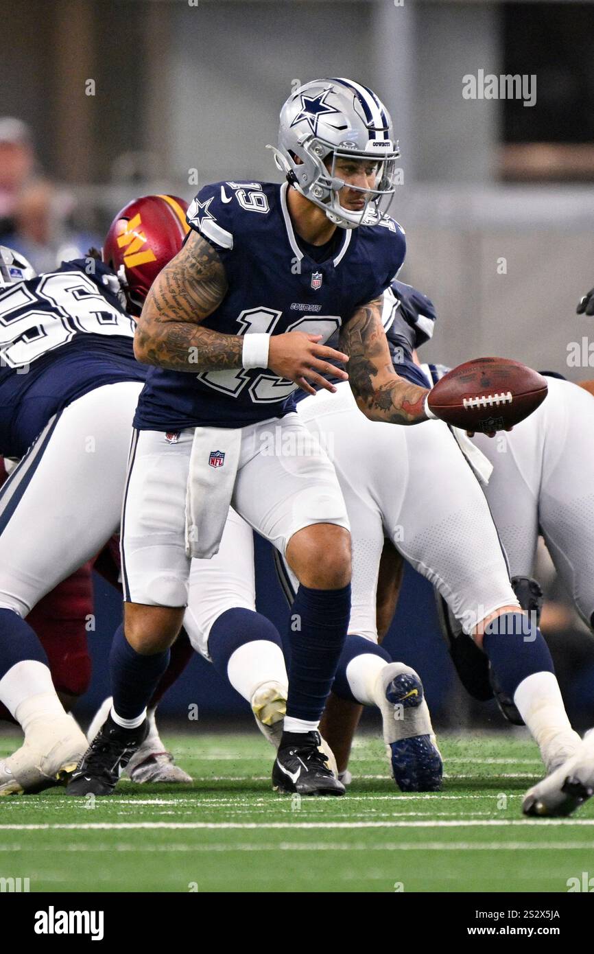 Dallas Cowboys quarterback Trey Lance (19) hands off the ball during an ...