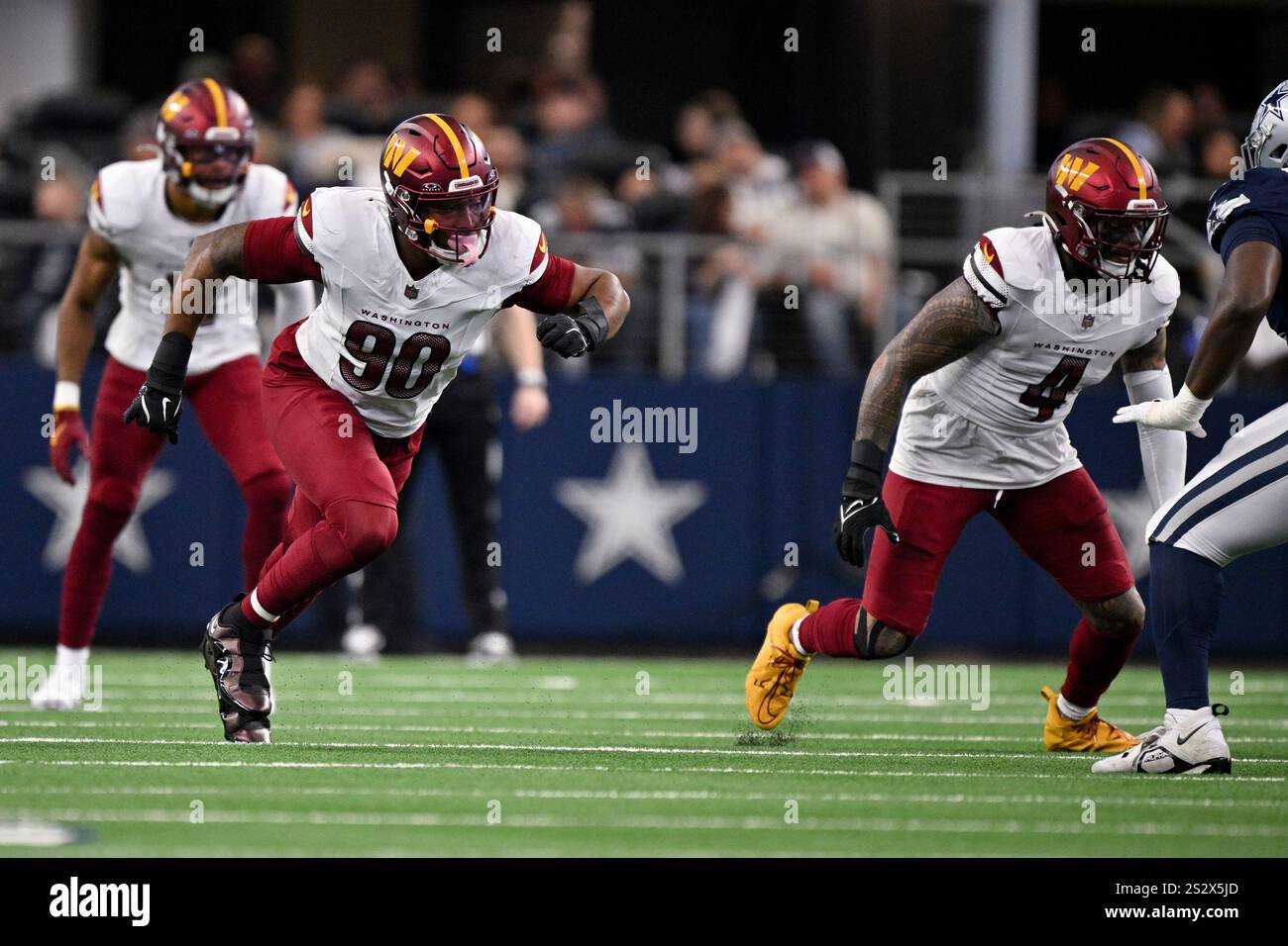 Washington Commanders defensive end Javontae Jean-Baptiste (90) and ...