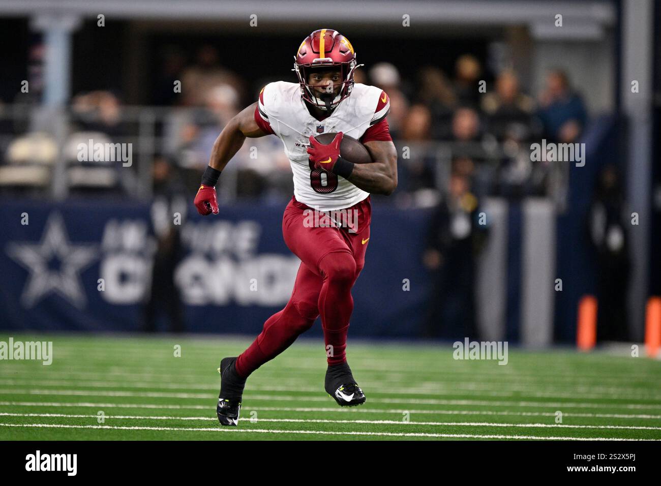 Washington Commanders running back Brian Robinson Jr. (8) runs with the ...