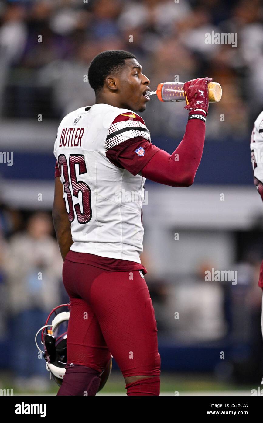 Washington Commanders safety Percy Butler (35) drinks from a water ...