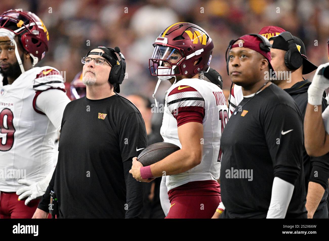 Washington Commanders coach Dan Quinn (left) and quarterback Marcus ...