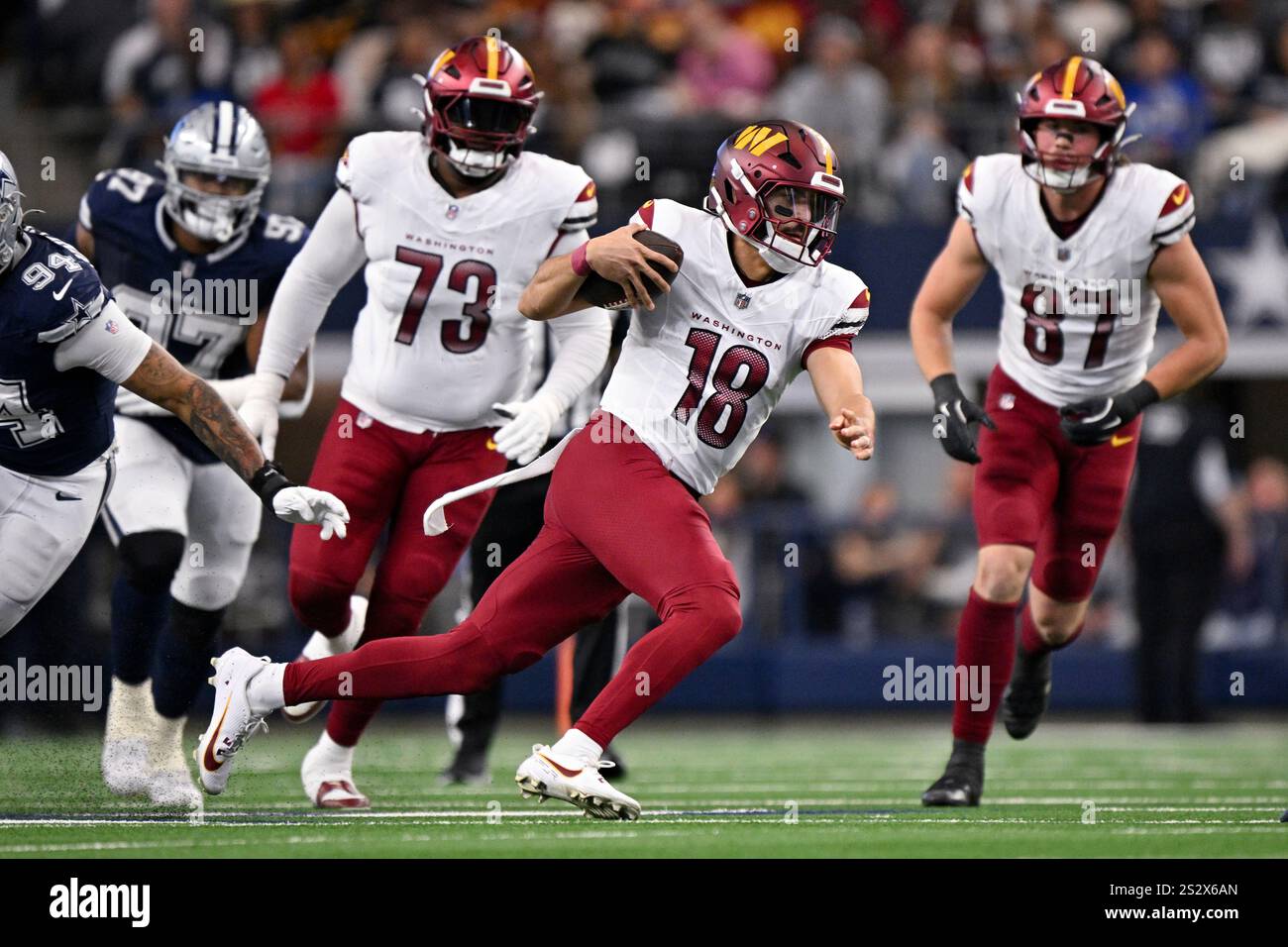 Washington Commanders quarterback Marcus Mariota (18) runs with the ...