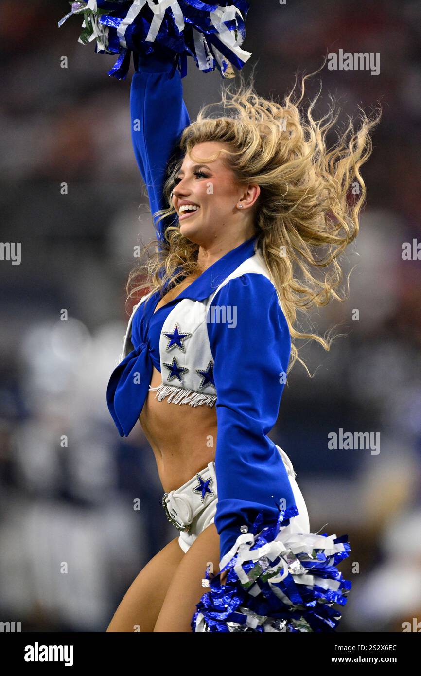 A Dallas Cowboys Cheerleader performs during an NFL football game ...