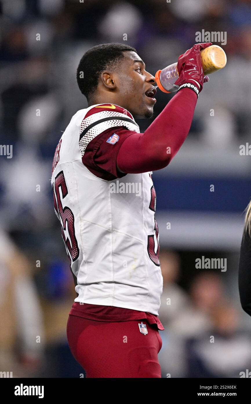 Washington Commanders safety Percy Butler (35) drinks from a water ...