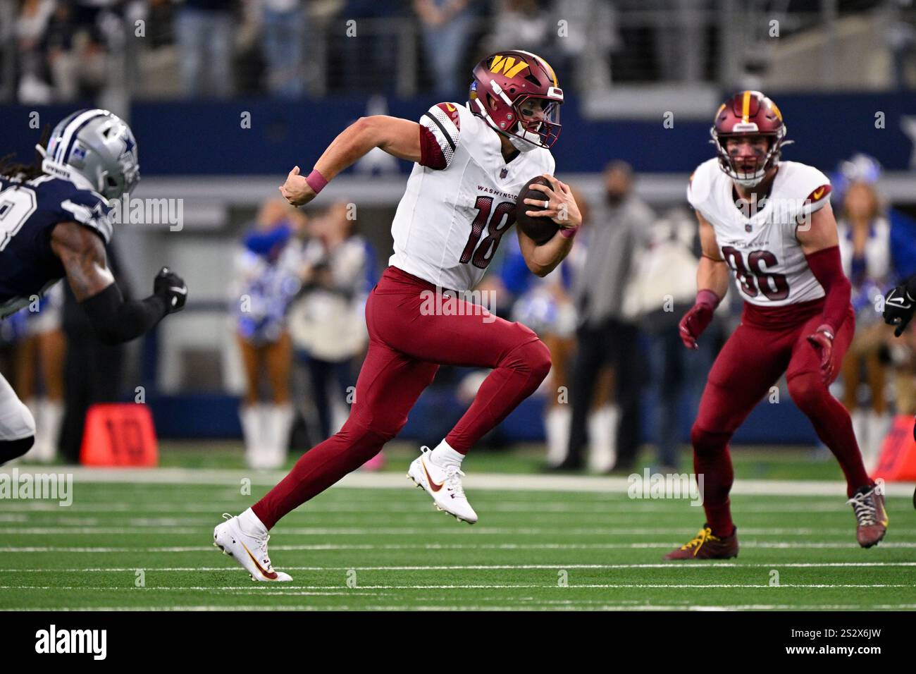 Washington Commanders quarterback Marcus Mariota (18) runs with the ...