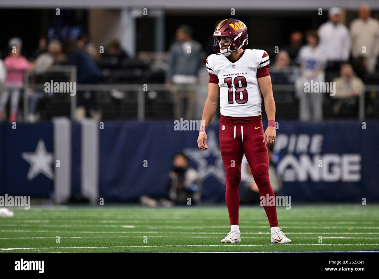 Washington Commanders quarterback Marcus Mariota (18) looks to the ...