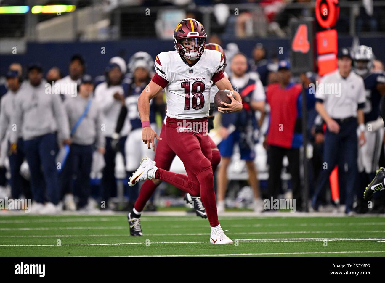 Washington Commanders quarterback Marcus Mariota (18) runs with the ...