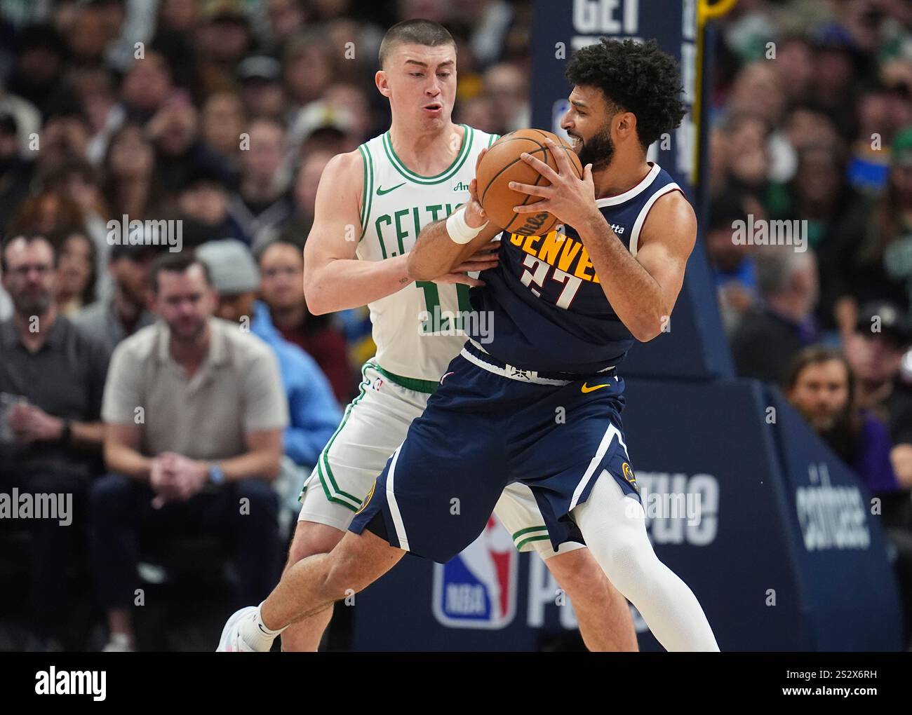 Denver Nuggets guard Jamal Murray, front, gets trapped with the ball by ...