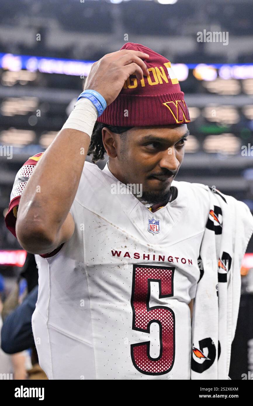 Washington Commanders quarterback Jayden Daniels (5) walks off the ...