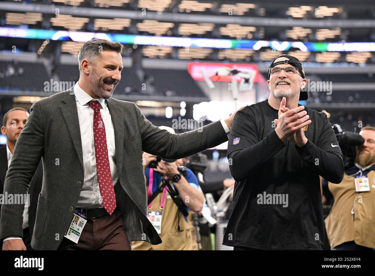 Washington Commanders general manager Adam Peters (left) and head coach ...