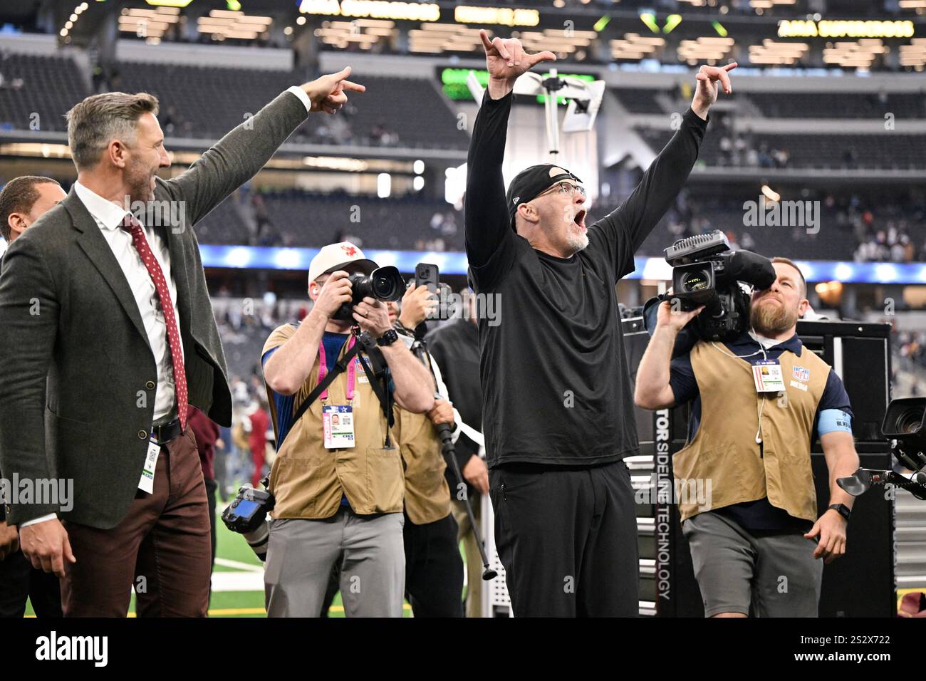 Washington Commanders general manager Adam Peters (left) and head coach ...