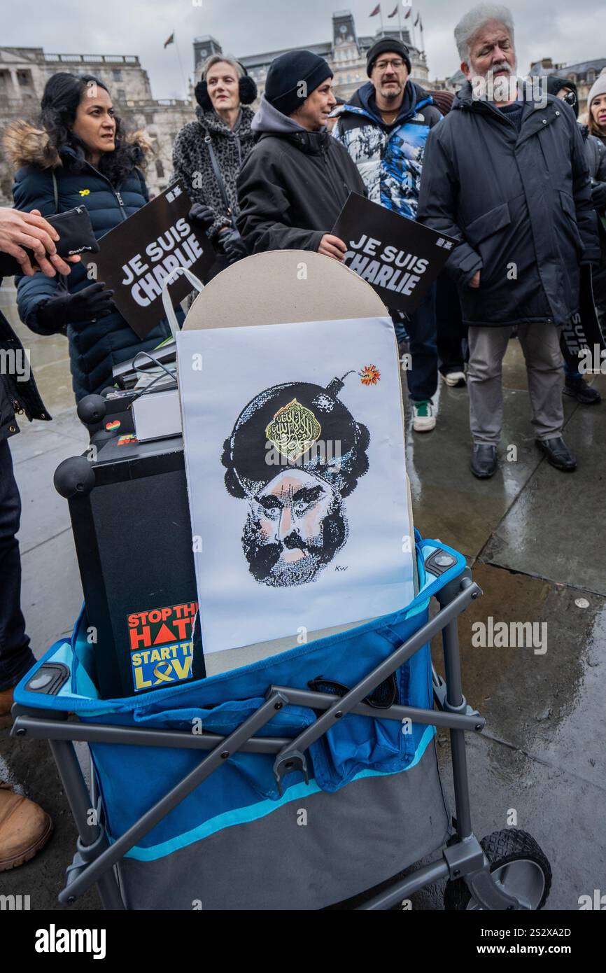 Activists holding up clippings and drawings from satirical French ...