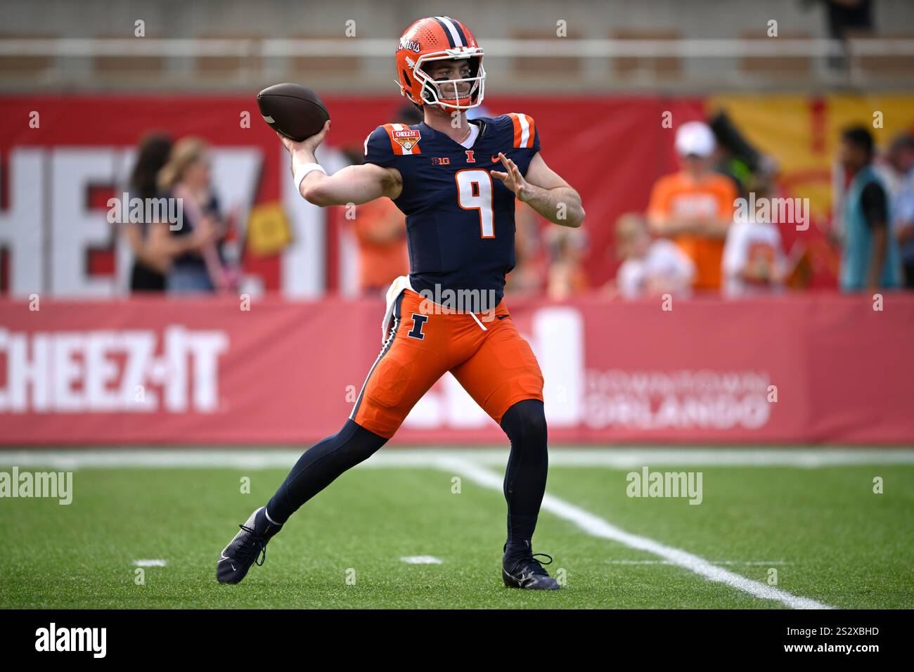 Illinois quarterback Luke Altmyer (9) warms up before the Citrus Bowl ...