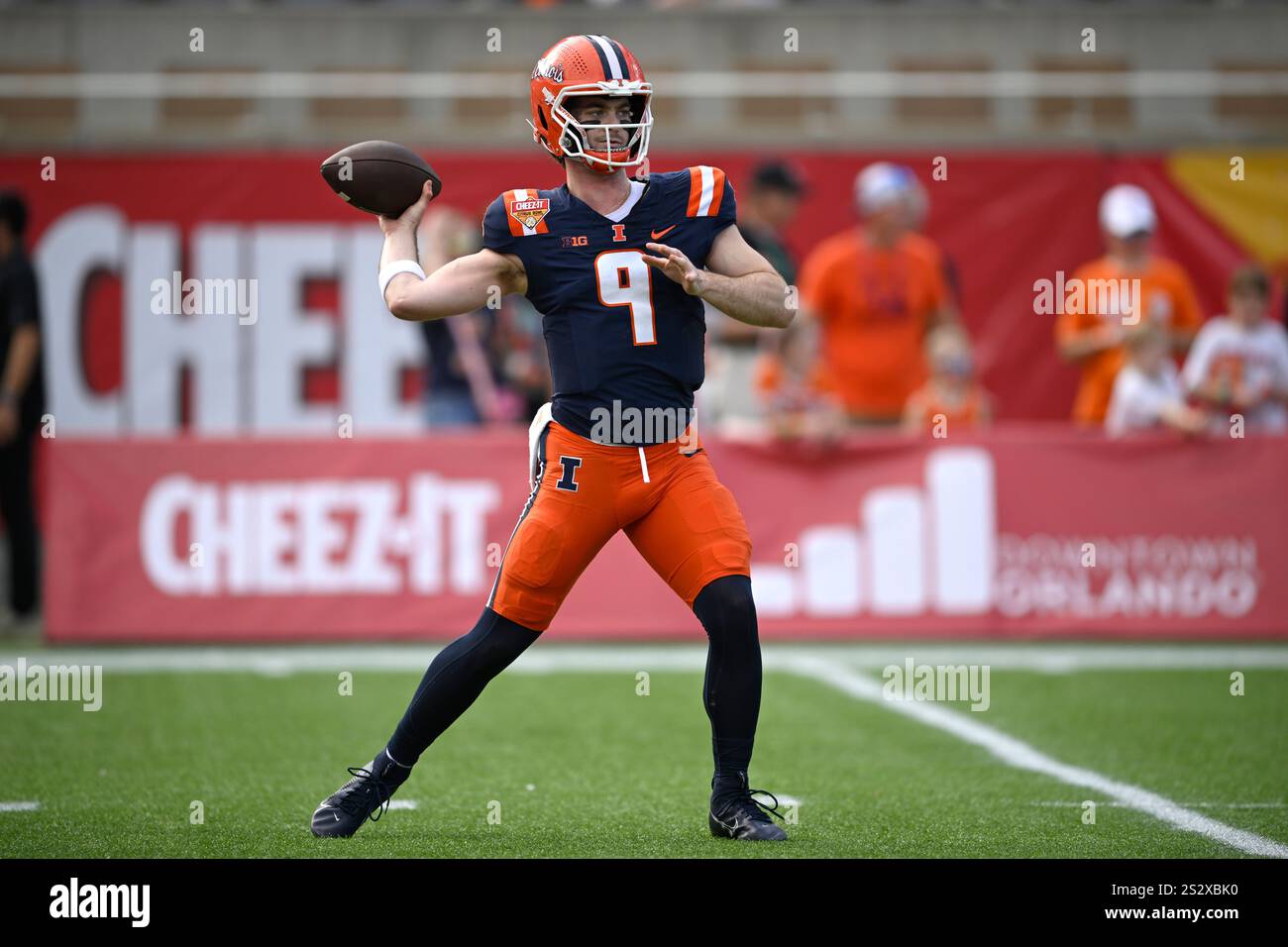 Illinois quarterback Luke Altmyer (9) warms up before the Citrus Bowl ...