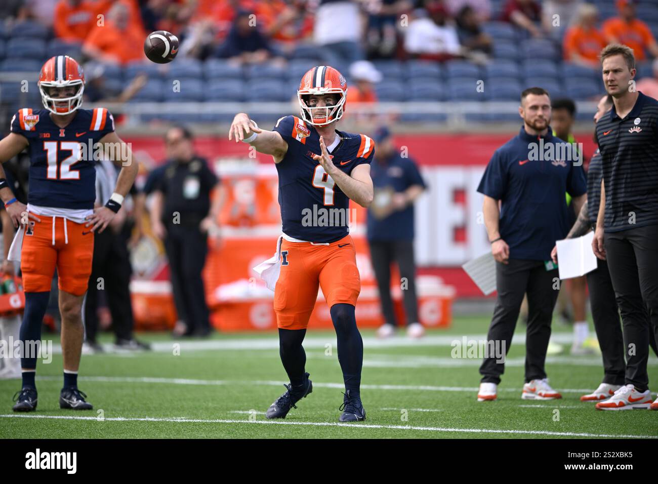 Illinois quarterback Luke Altmyer (9) warms up before the Citrus Bowl ...