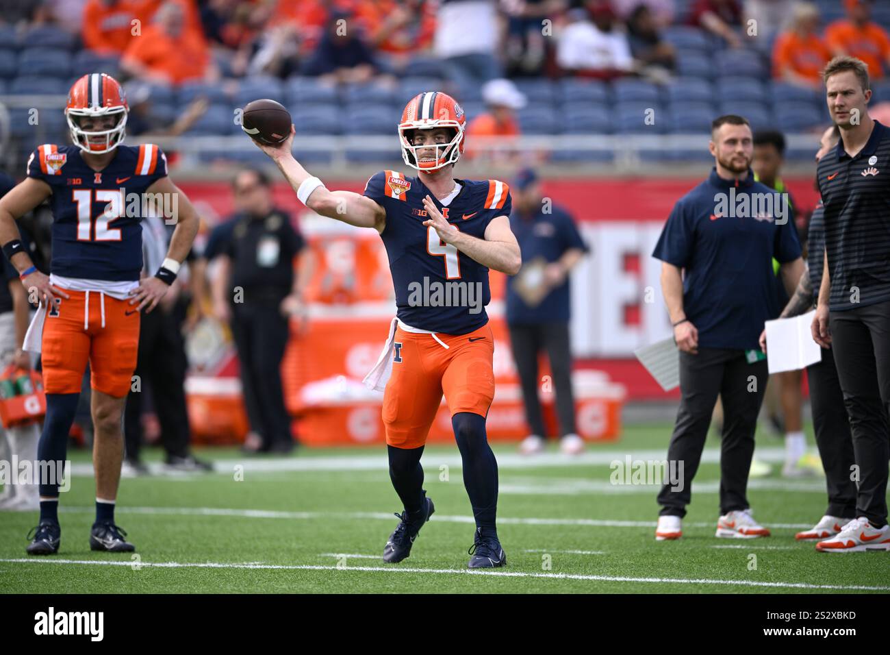Illinois quarterback Luke Altmyer (9) warms up before the Citrus Bowl ...