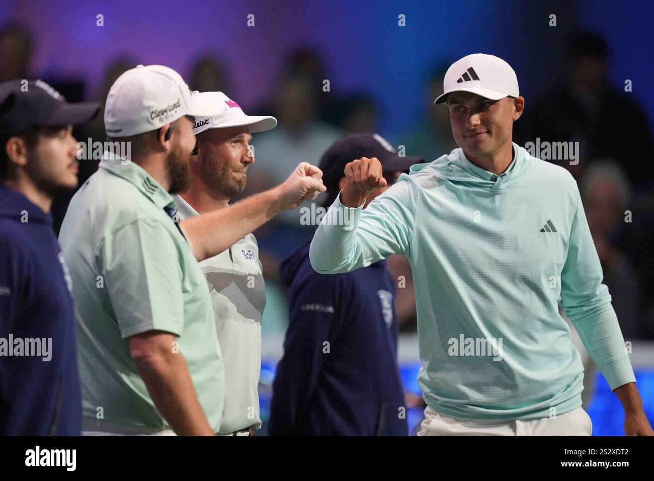 Ludvig Aberg of The Bay Golf Club, right, bumps fists with teammates ...