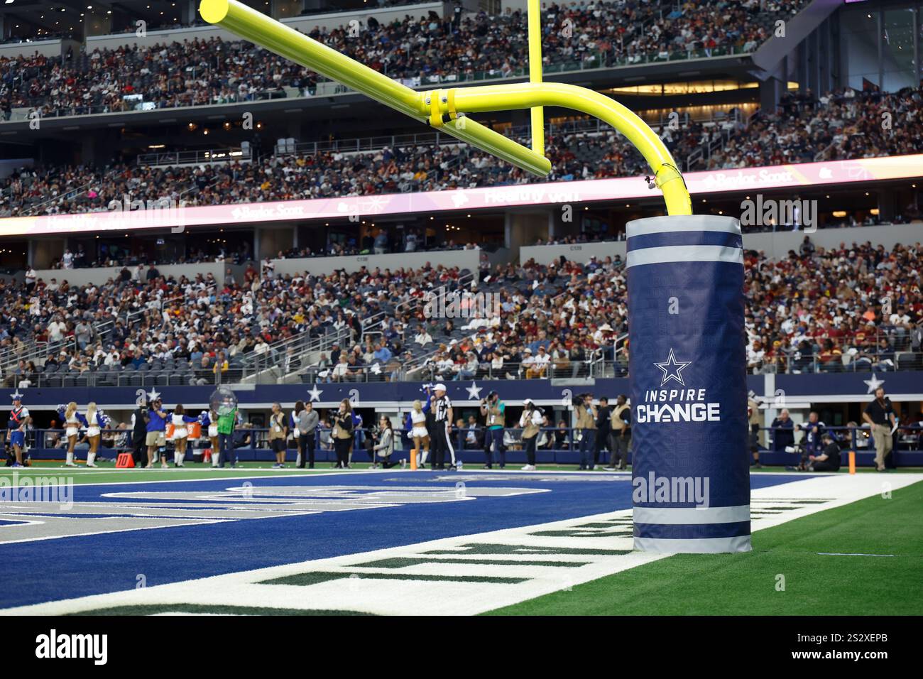 The goal post wrap at AT&T Stadium shows the NFL's "Inspire Change" in ...