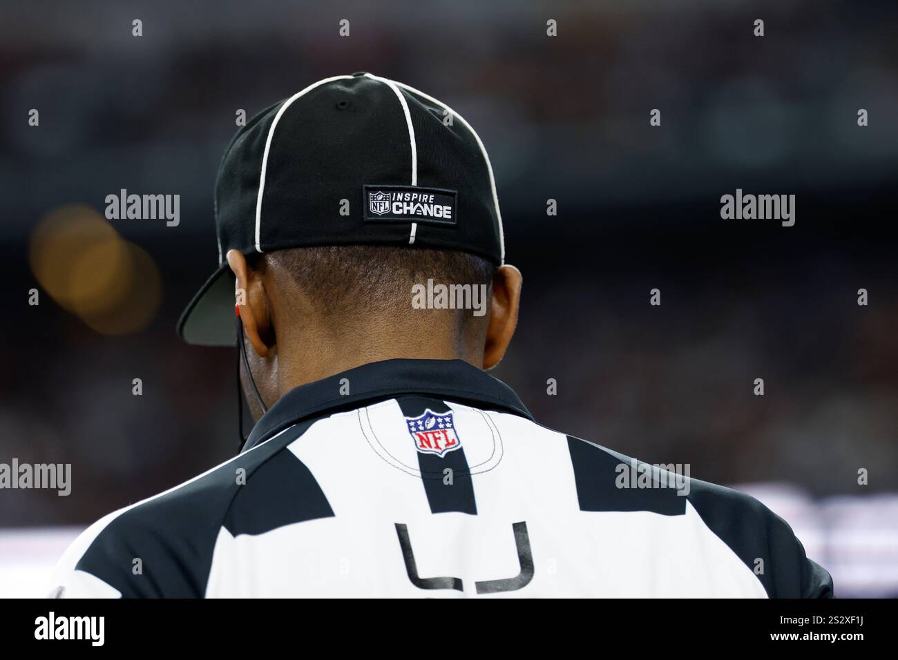 NFL line judge Julian Mapp (10) with the NFL's "Inspire Change" logo on ...