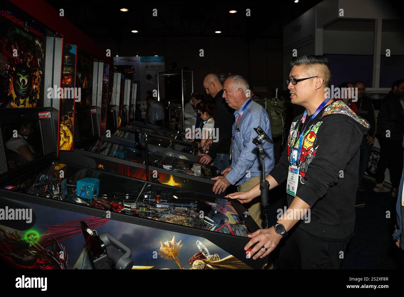 January 7, 2025: An attendee plays a Stern Technology pinball machine ...