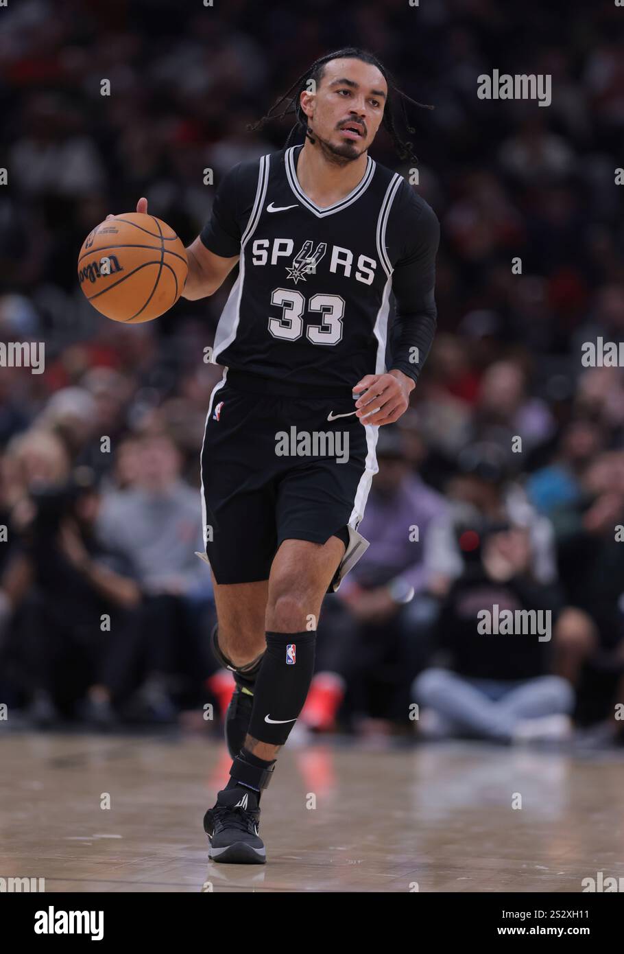 CHICAGO, IL - JANUARY 06: Tre Jones #33 of the San Antonio Spurs brings ...