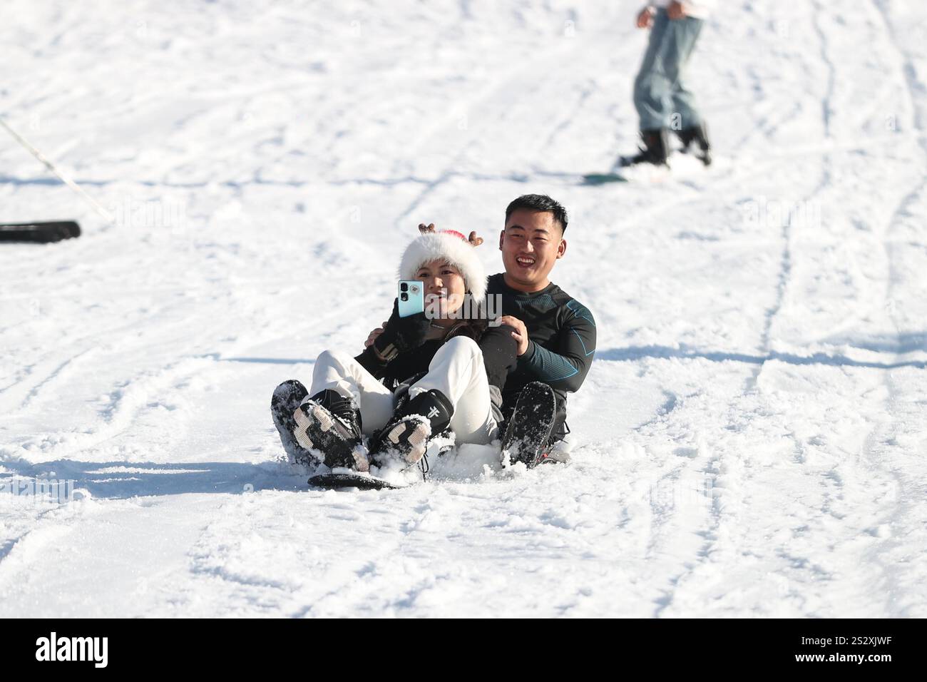 **CHINESE MAINLAND, HONG KONG, MACAU AND TAIWAN OUT** People enjoy snow ...