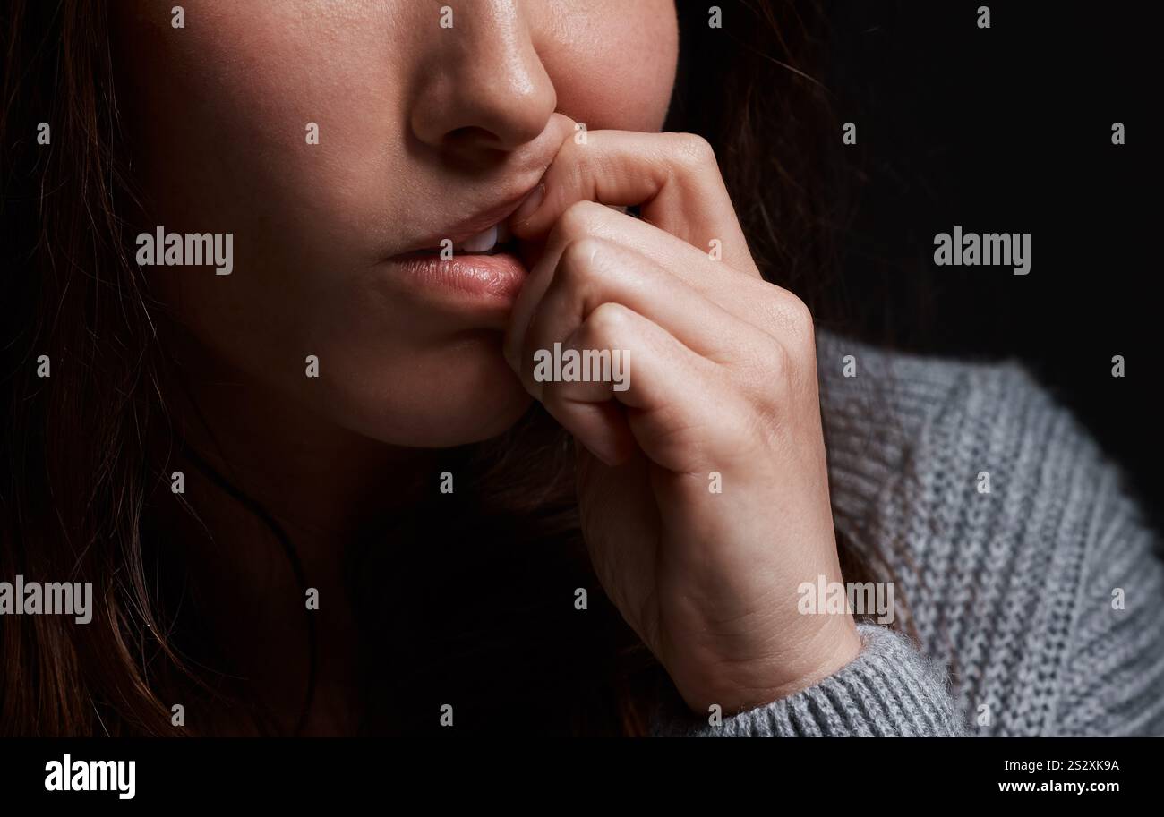 Stress, hands and person biting nails in fear for domestic violence ...