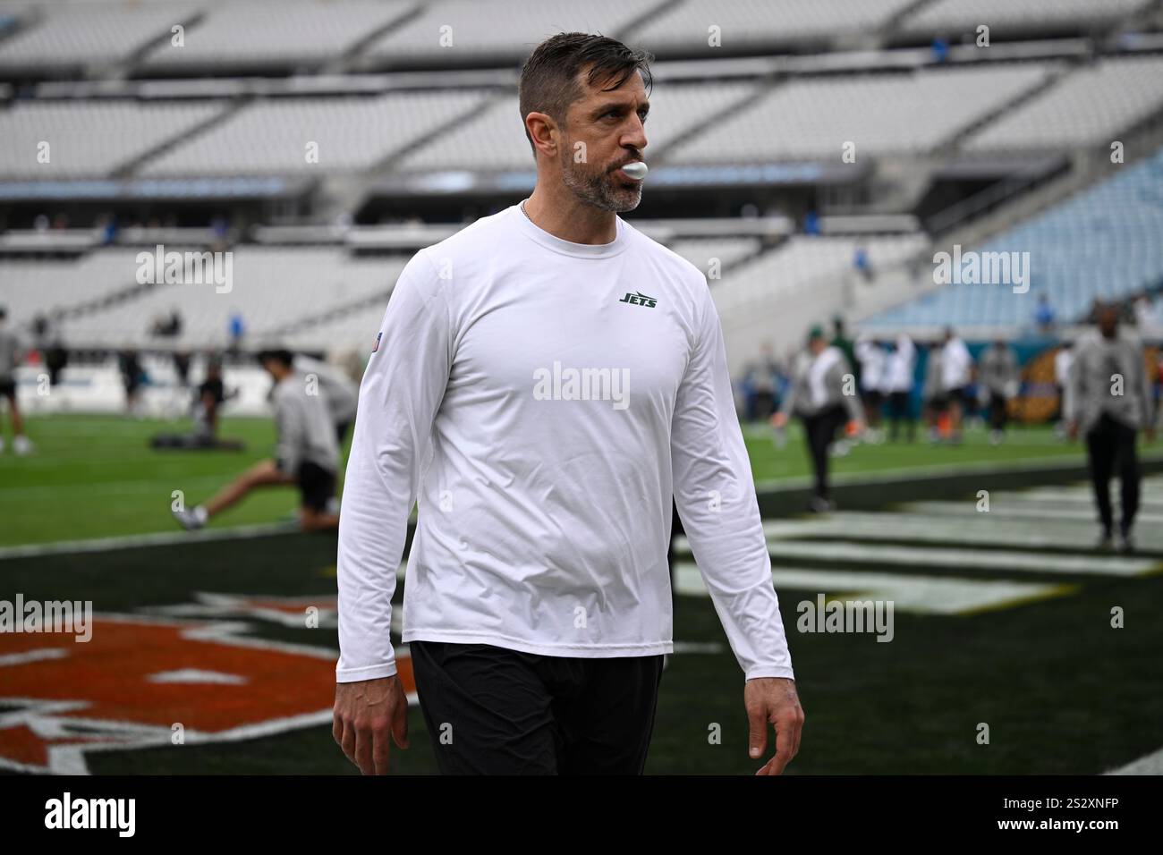 New York Jets quarterback Aaron Rodgers leaves the field after warming ...