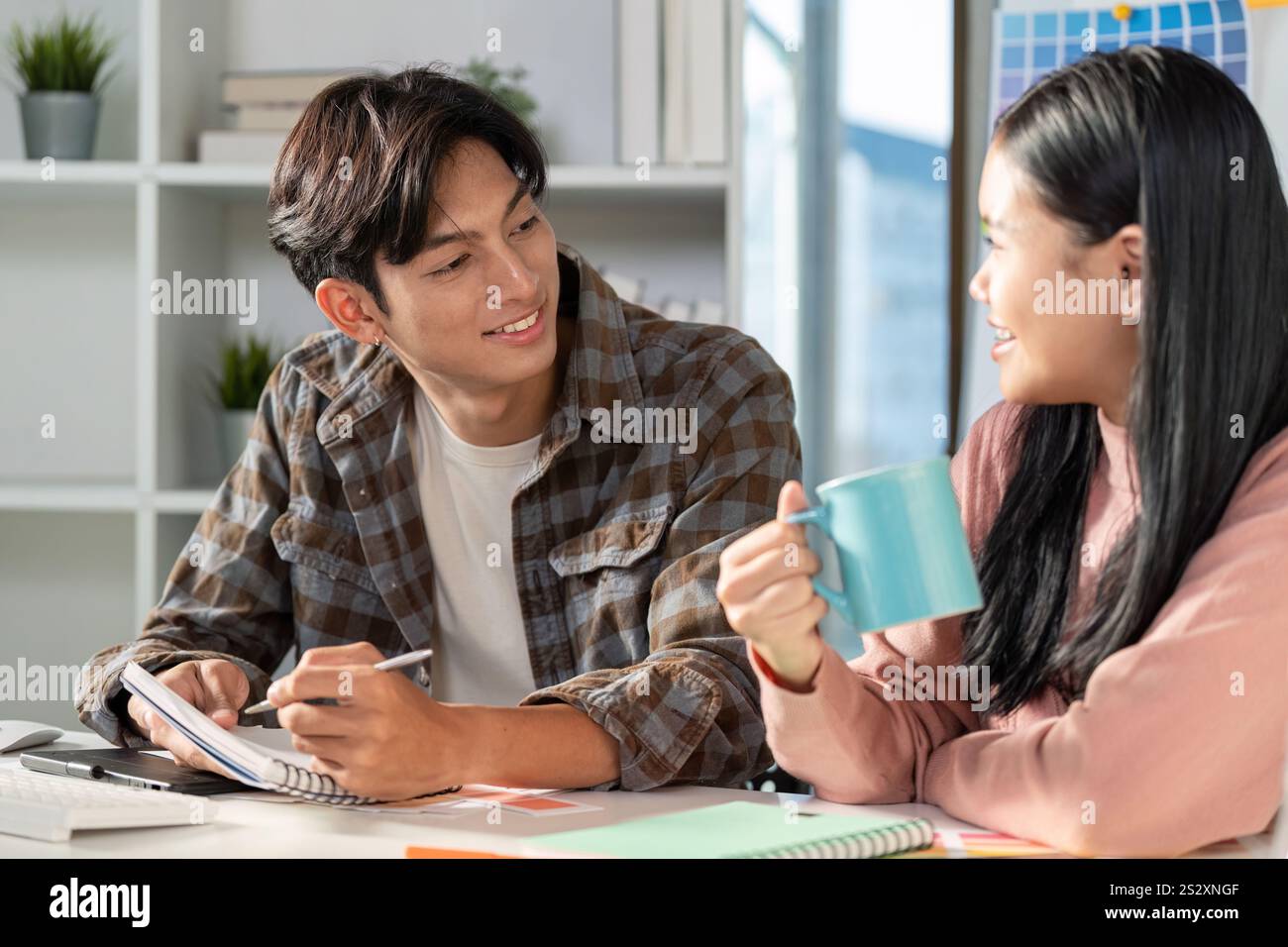 Team meeting on graphic design strategies with color charts in a modern ...