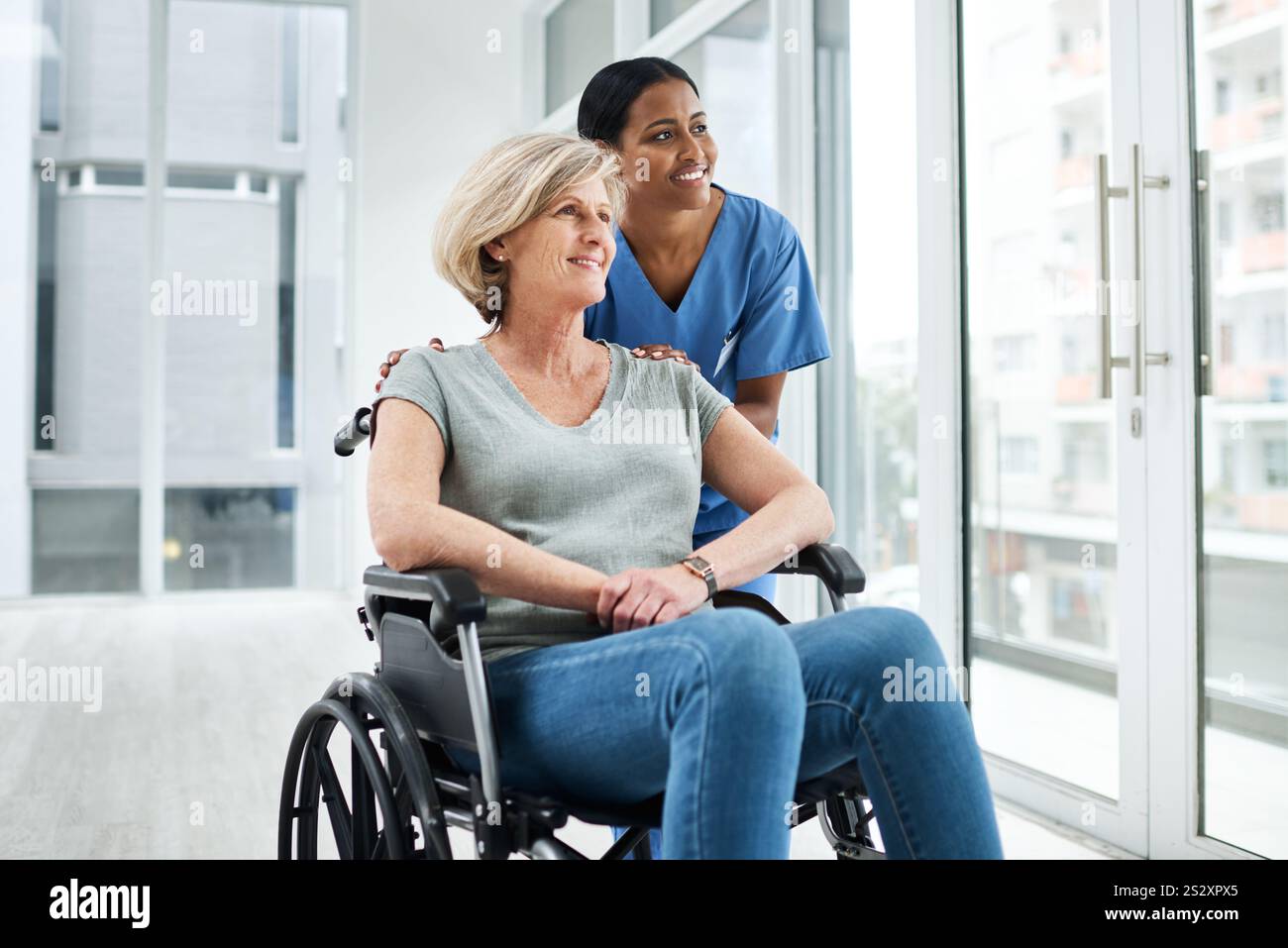 Thinking, caregiver and elderly woman in wheelchair of rehabilitation ...