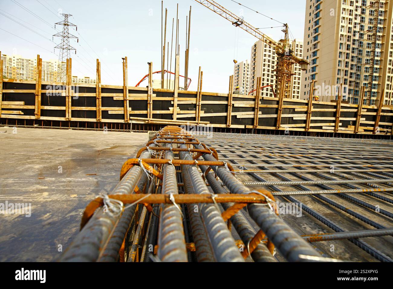worker in the construction site making reinforcement metal framework ...