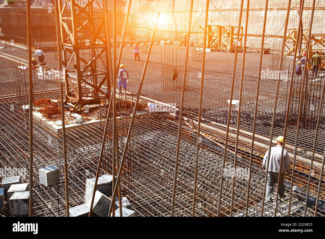 worker in the construction site making reinforcement metal framework ...
