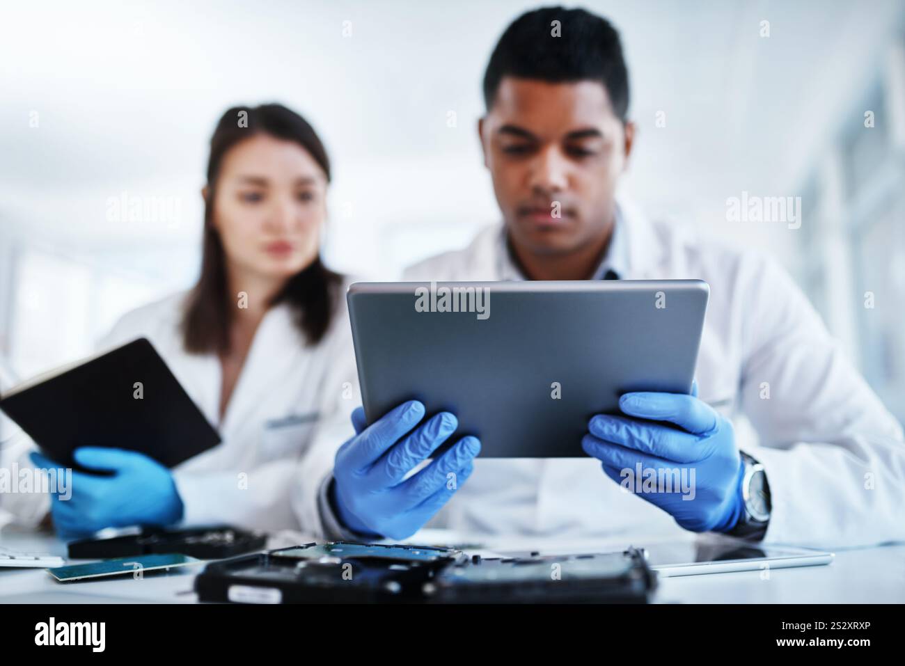 Lab, engineer and hands with tablet, repairing and collaboration for ...