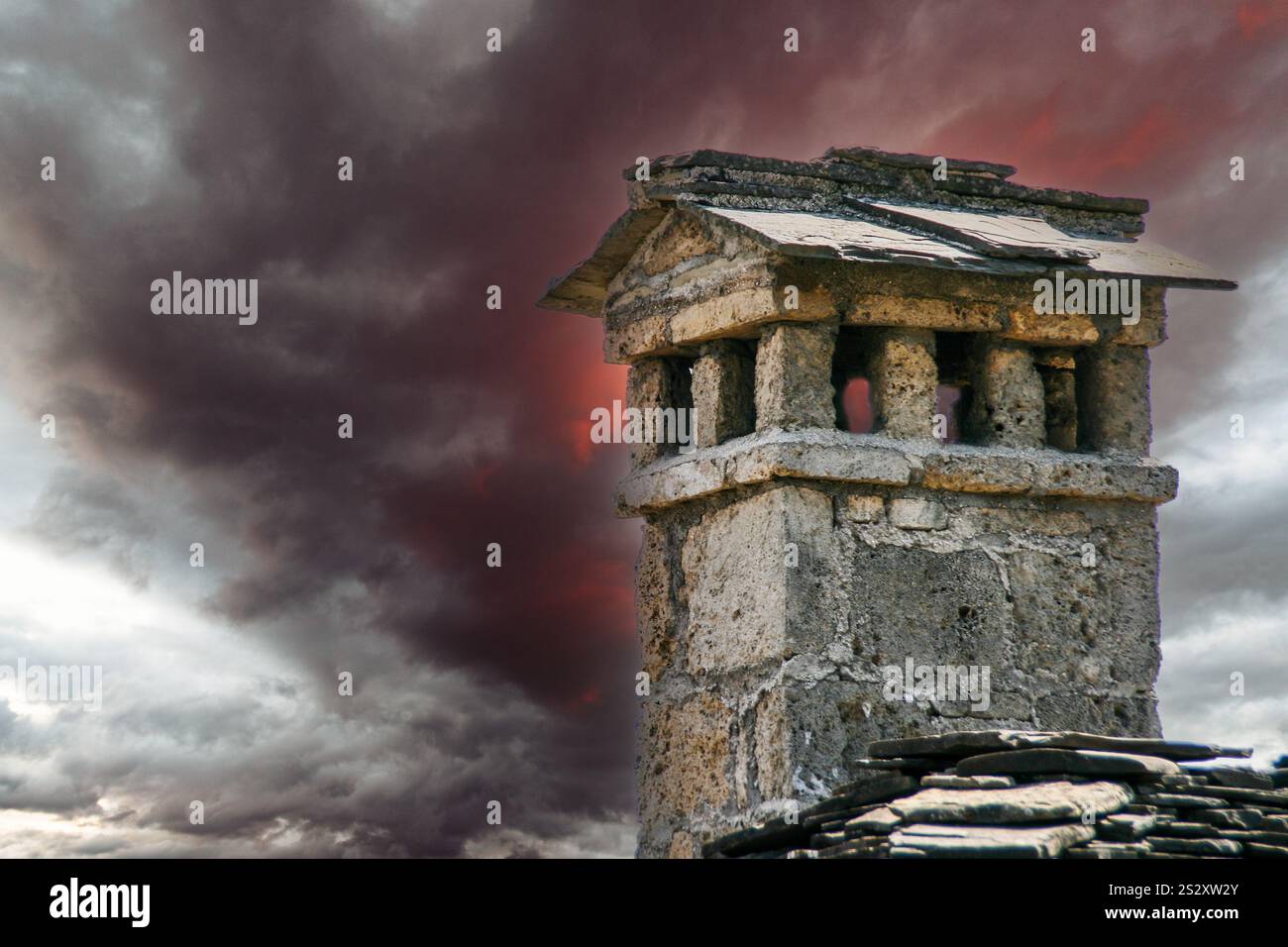 Typical traditional greek, made out local stone chimney and roof on ...
