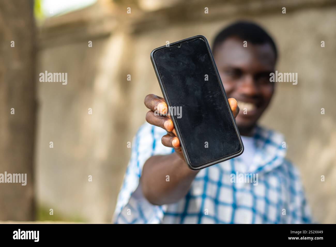 Recommendation. Portrait of excited African American black guy holding ...
