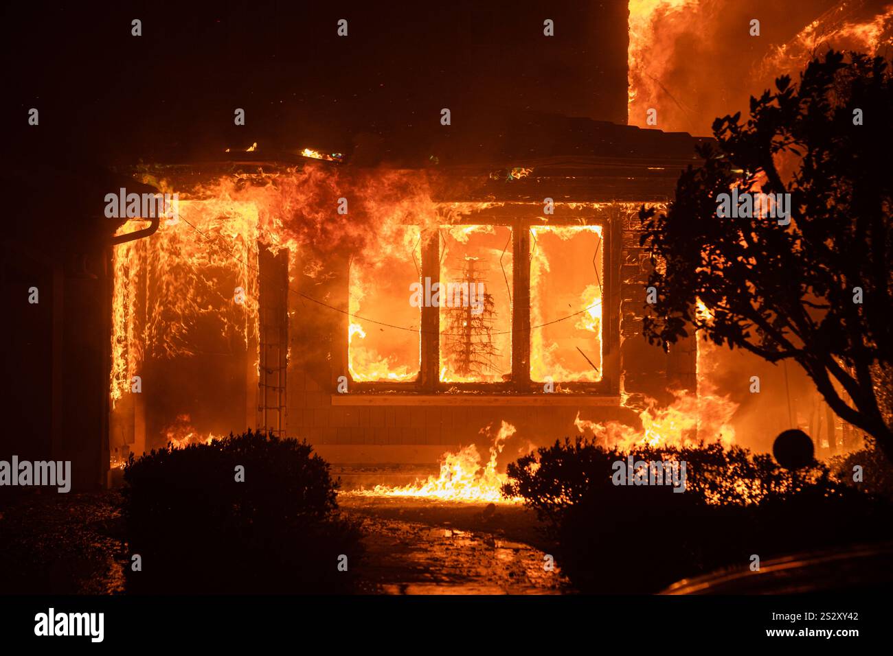 PACIFIC PALISADES, CALIFORNIA - JANUARY 07: A Christmas tree burns ...