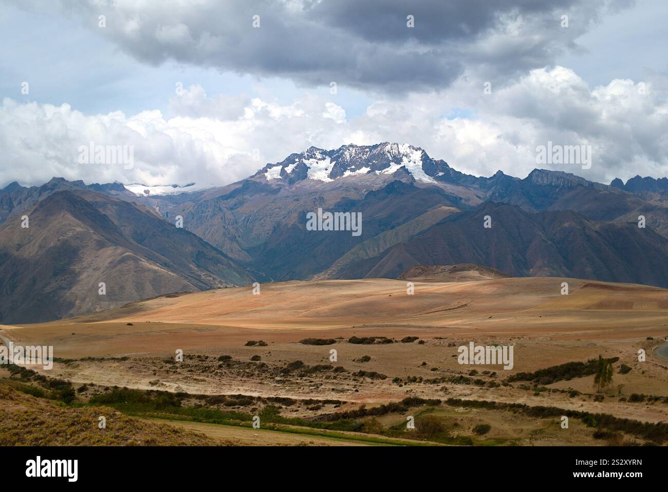 Dramatic Andean vista featuring snow-capped Chicon peak, rugged ...